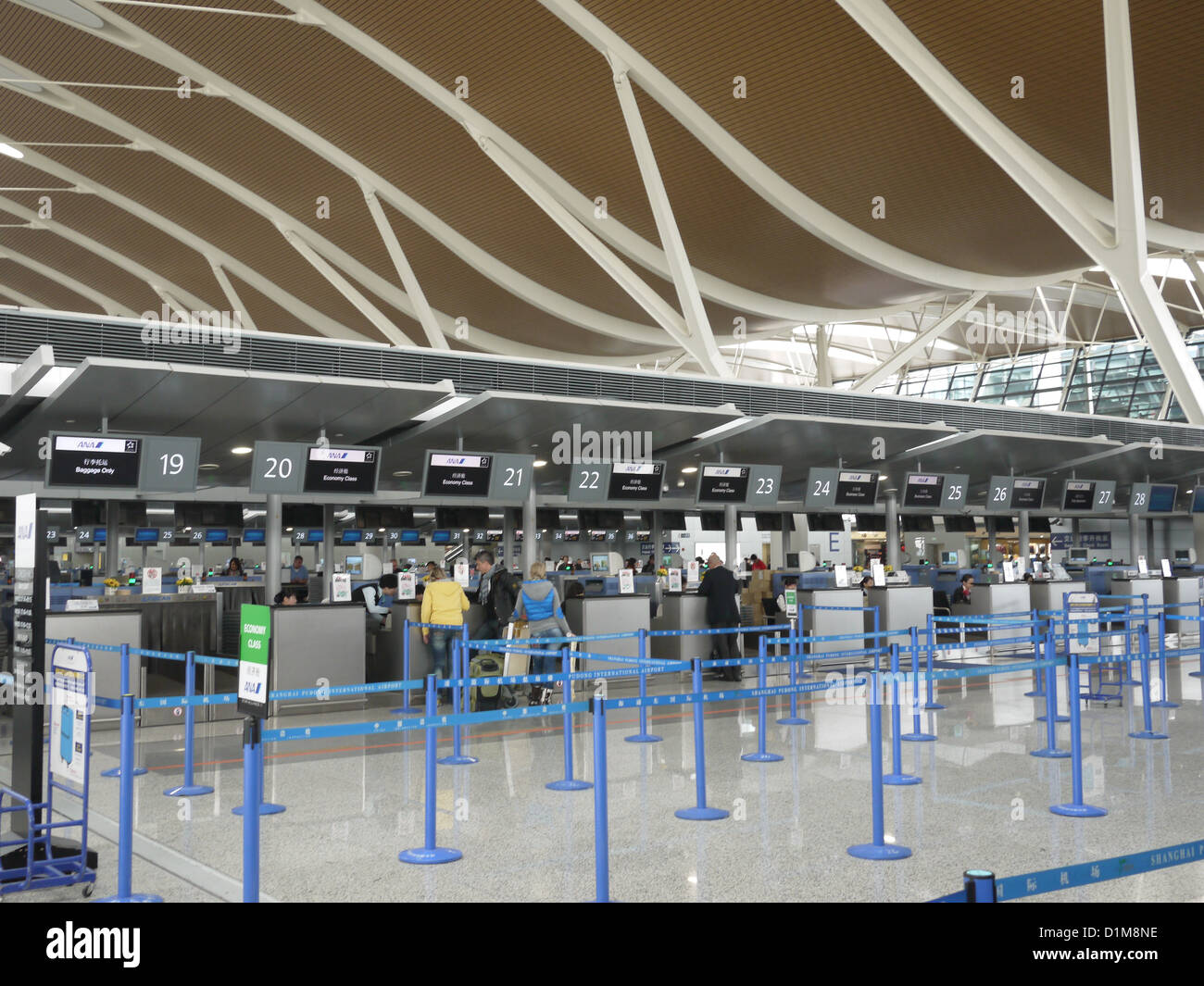 airport sign-in line counter china terminal Stock Photo - Alamy
