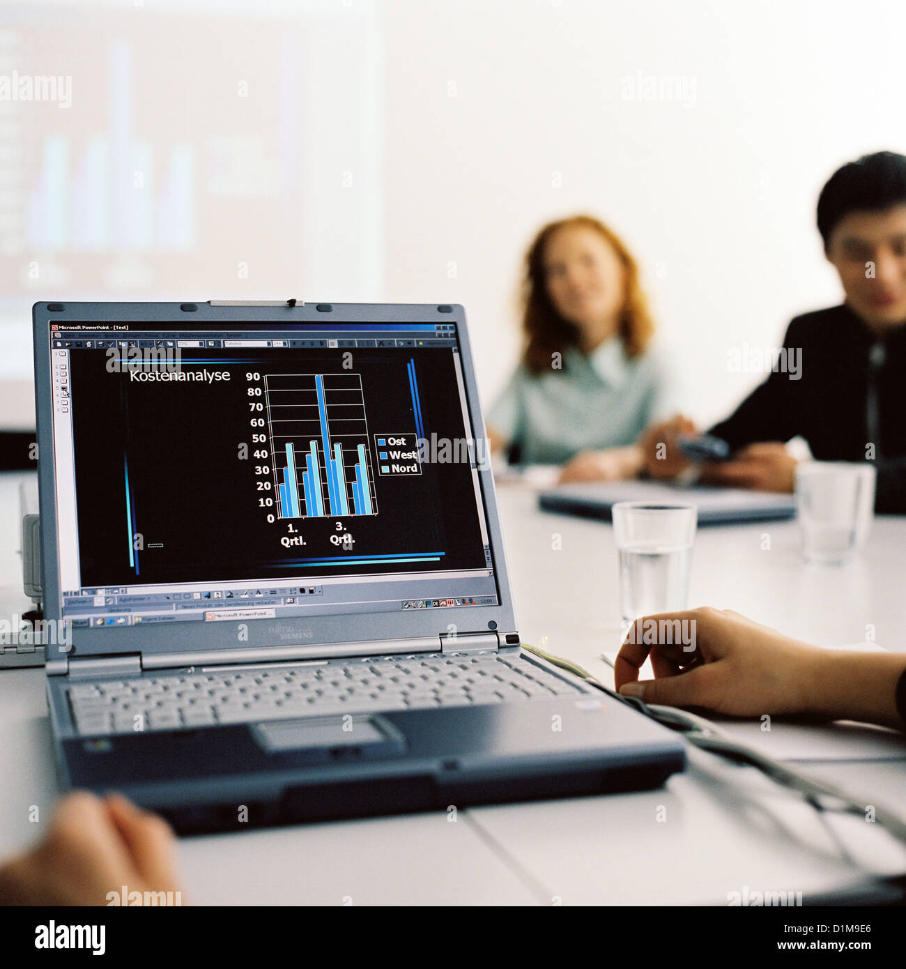Laptop with graph showing rising profits on screen License free except ...