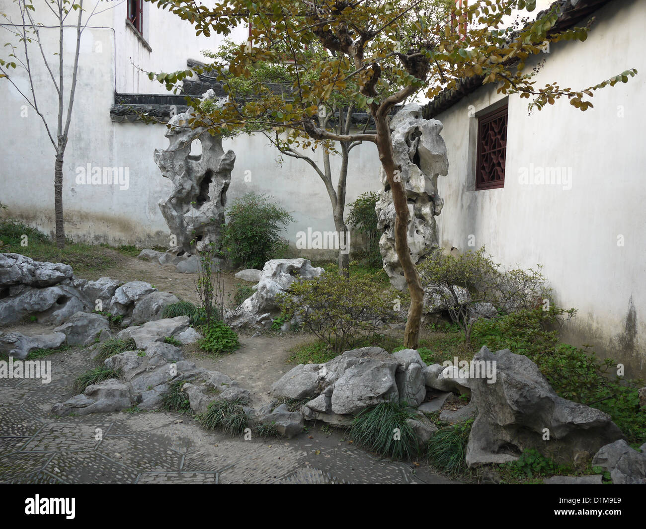 small indoor ugly unmaintained chinese garden Stock Photo - Alamy