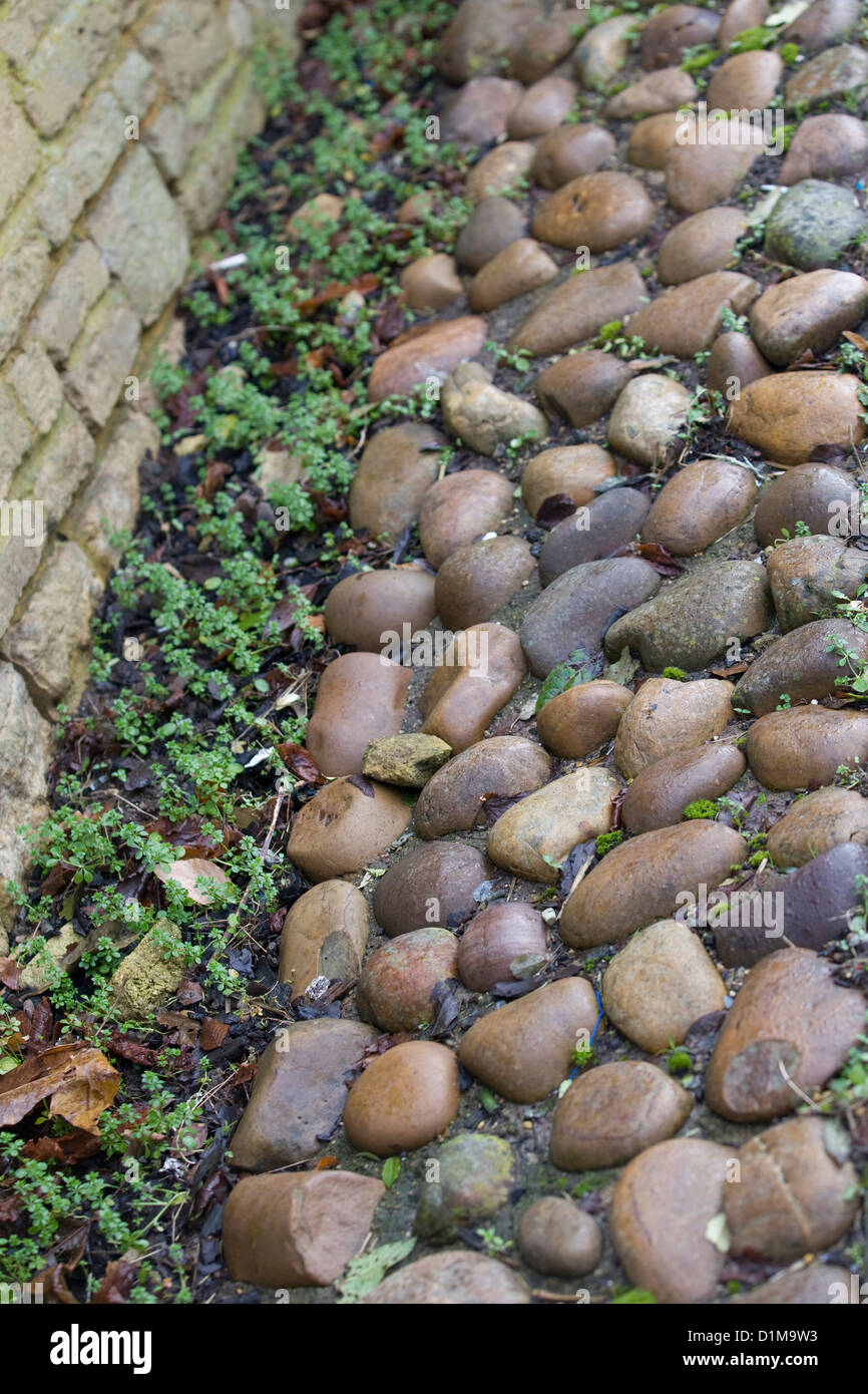 Pathway of Cobbles against a wall in Oxfordshire England Stock Photo ...