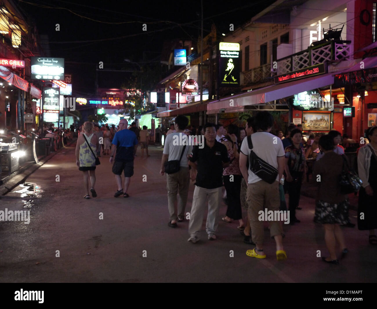 busy street crowd people touring visitors night Stock Photo - Alamy