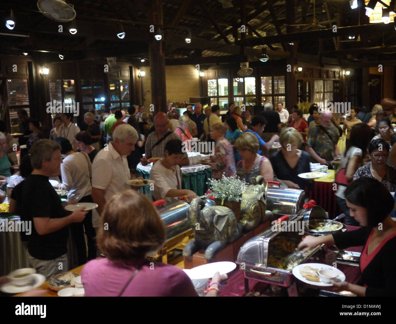 tourist lineup buffet restaurant Asia Stock Photo - Alamy