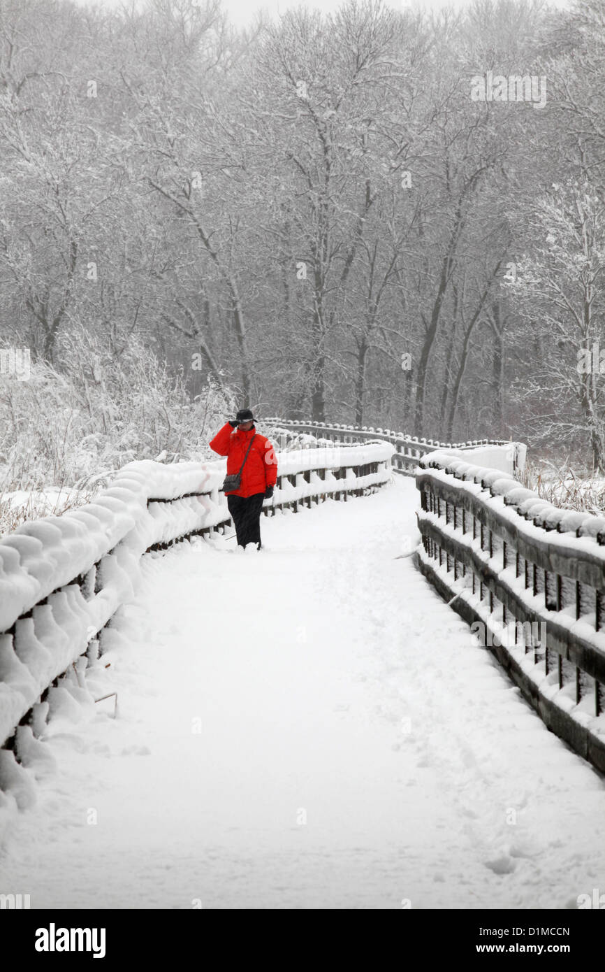 WALKING ACROSS SNOW-COVERED BRIDGE IN ANOKA COUNTY, MINNESOTA. WINTER ...