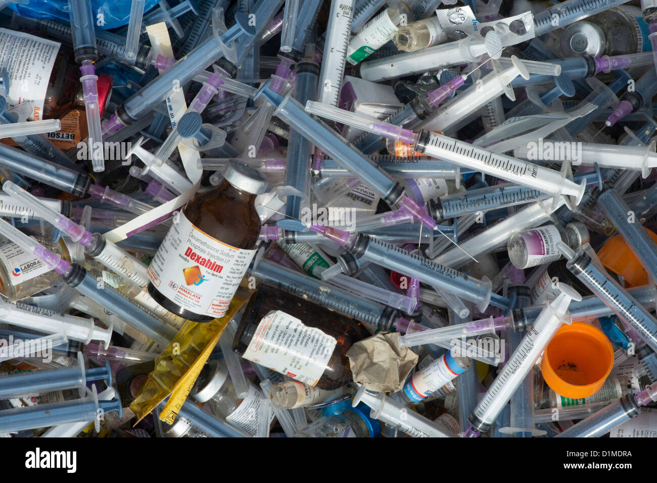 Hypodermic syringes with needles dumped in rubbish in the Indian ...