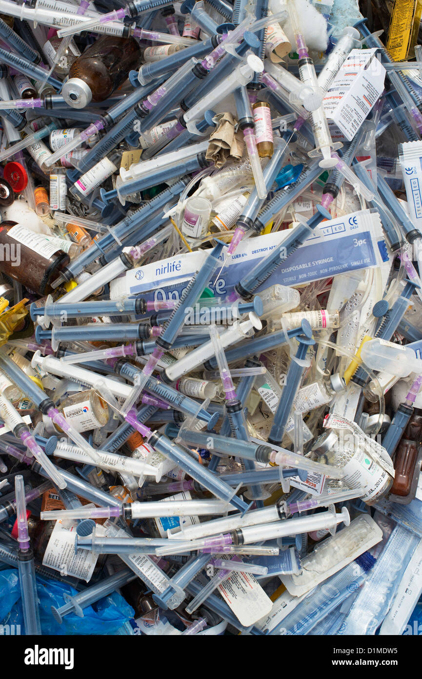 Hypodermic syringes with needles dumped in rubbish in the Indian ...