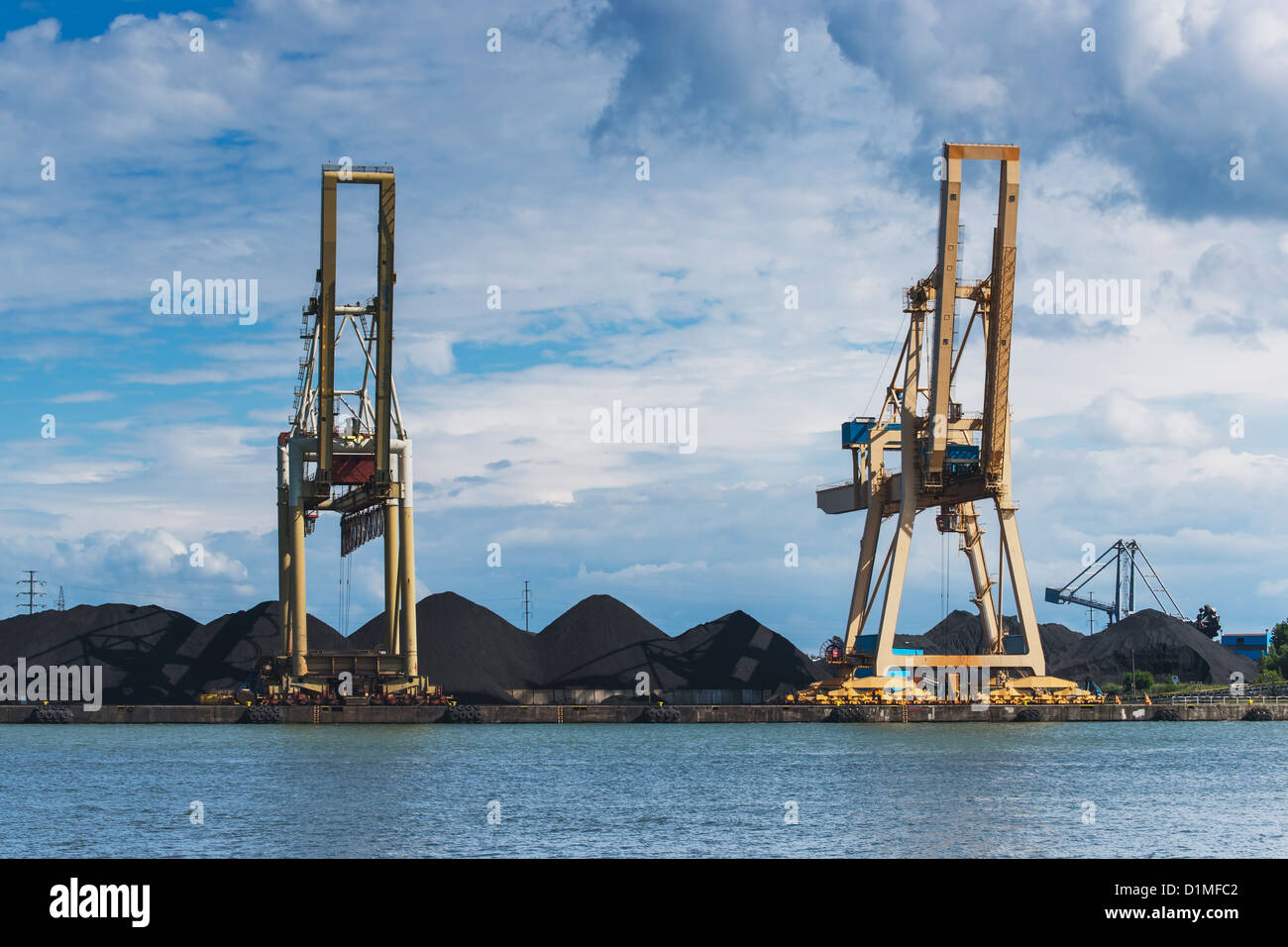 View over the Swina river to the cranes of the coal harbor, Swinoujscie ...