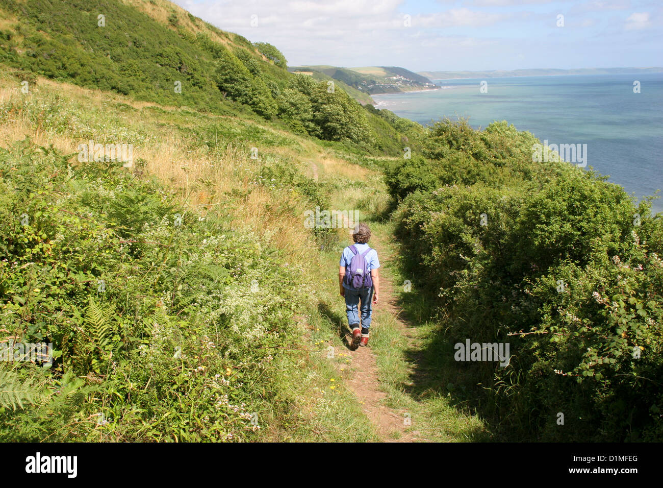 walker Cornwall Coast Path towards Seaton near Looe Cornwall England UK ...