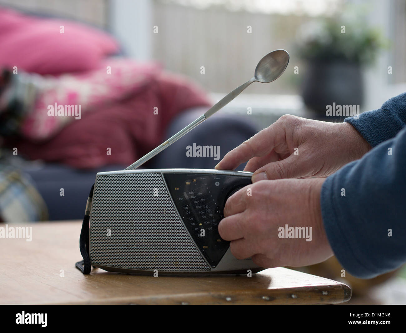 An old battered fm radio with the aerial repaired with a spoon Stock ...