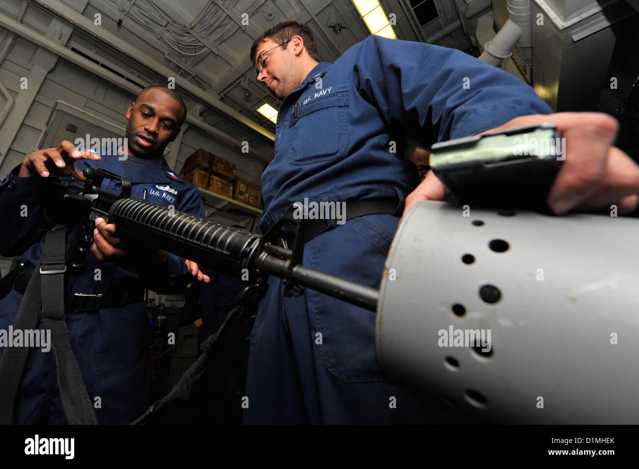 Personnel Specialist 2nd Class Casan Lino demonstrates proper clearing ...