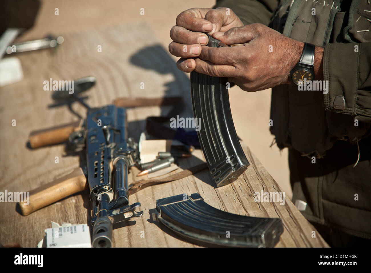 A coalition force member engages in live fire training with a Mark 44 ...