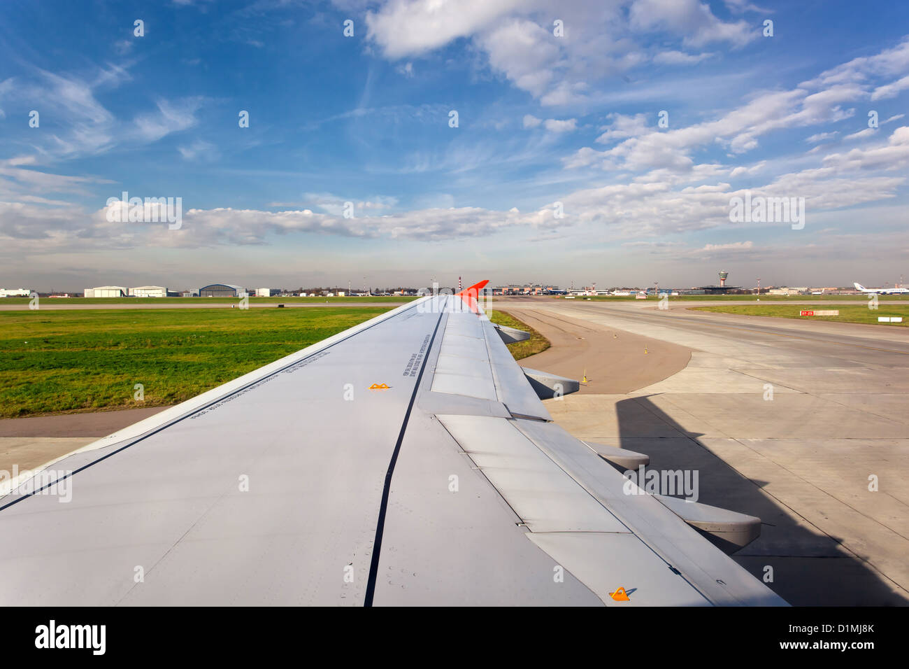 Airplane on landing strip Stock Photo - Alamy