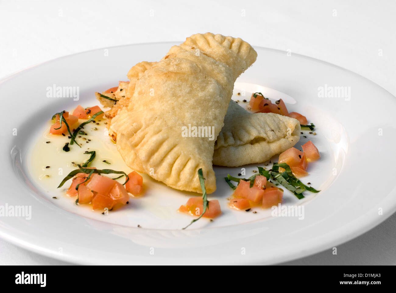 Salami, Provola and Ricotta Calzone, with Tomato & Basil Ragu Stock ...