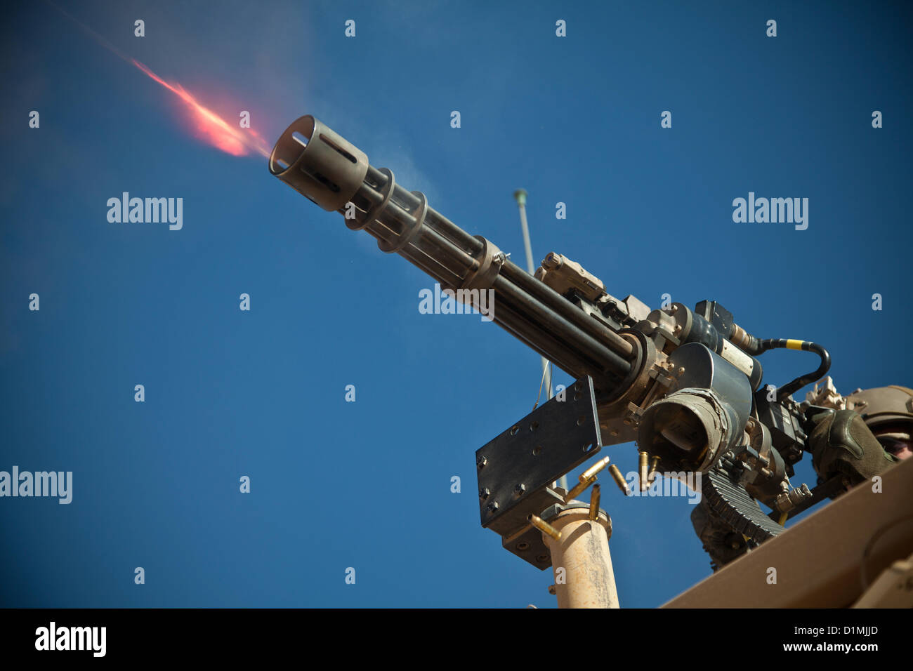 A coalition force member fires the Mark 44 minigun during live fire ...