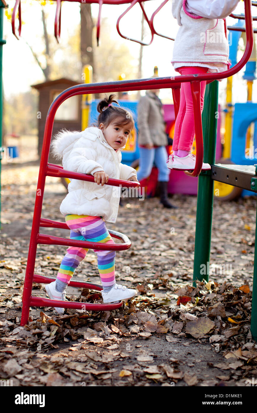 Little girl at the playground Stock Photo - Alamy