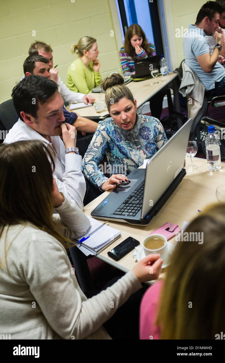 Journalists with laptop computer in a workshop class on how to use ...