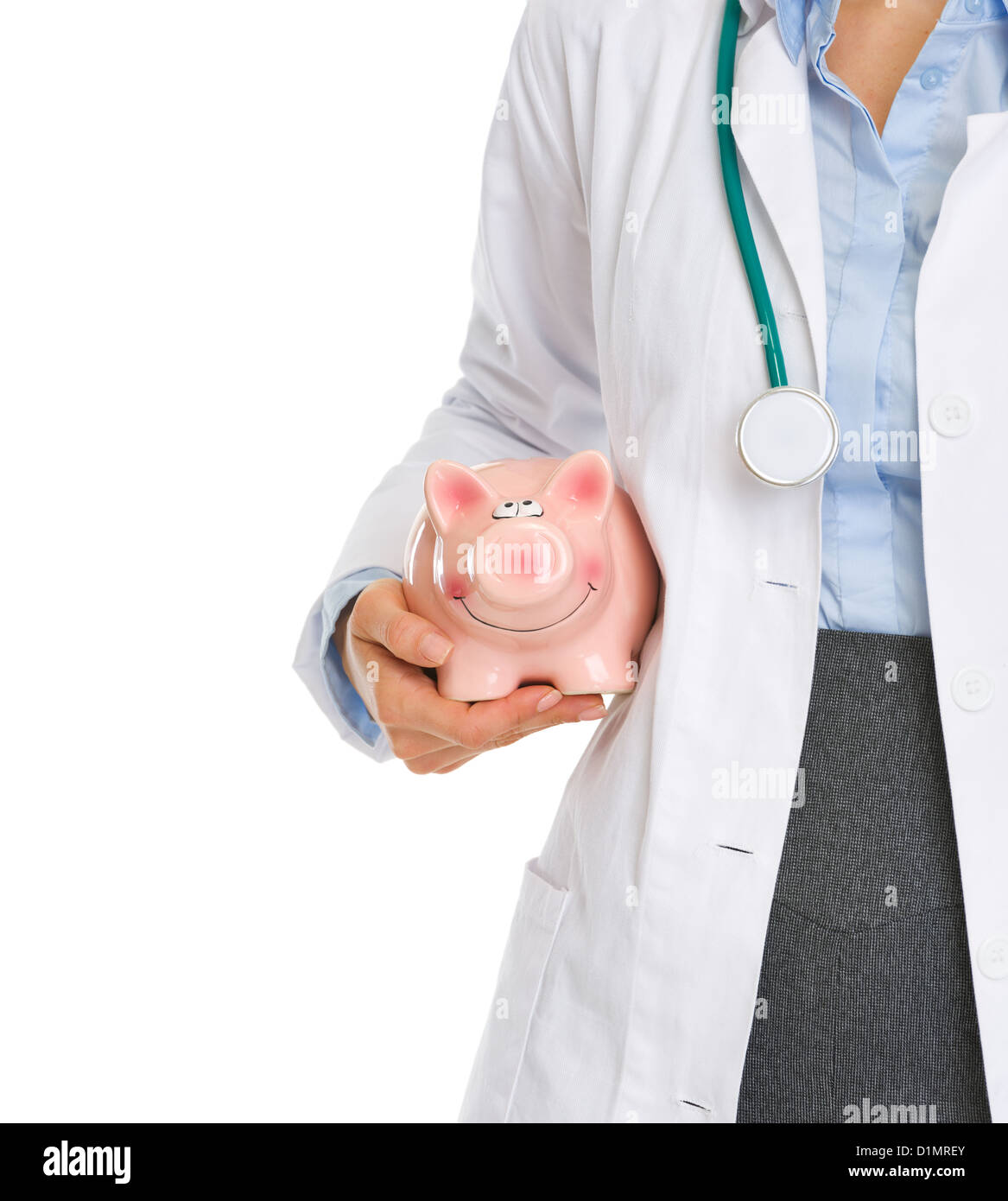 Closeup on medical doctor holding piggy bank Stock Photo - Alamy