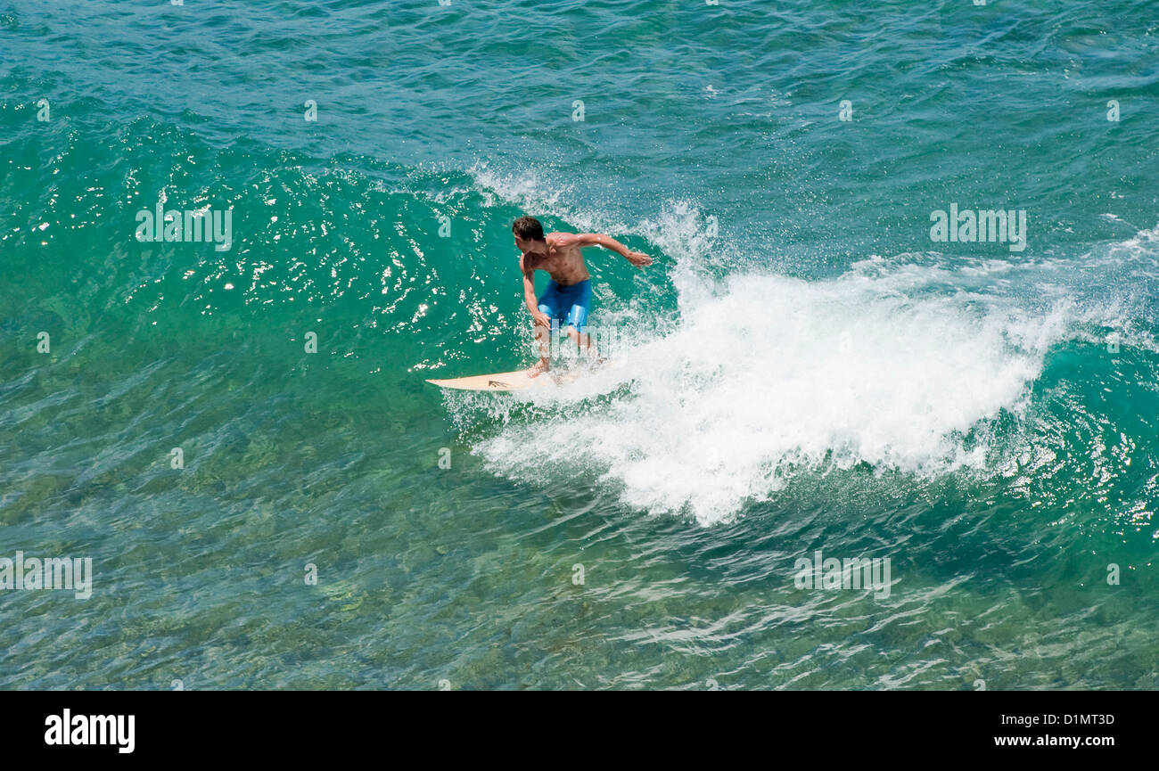 A young man surfs of the coast Maui, Hawaii Stock Photo - Alamy