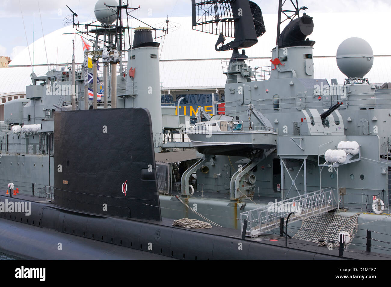 hmas onslow submarine moored alongside hmas vampire, a destroyer, at ...