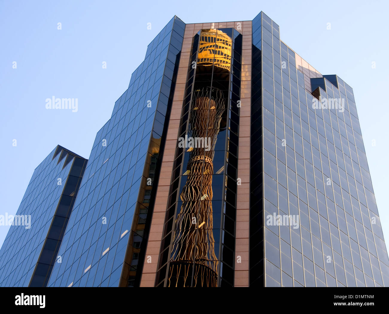 The reflection of Sydney's Centrepoint Tower in the glass facade of an ...