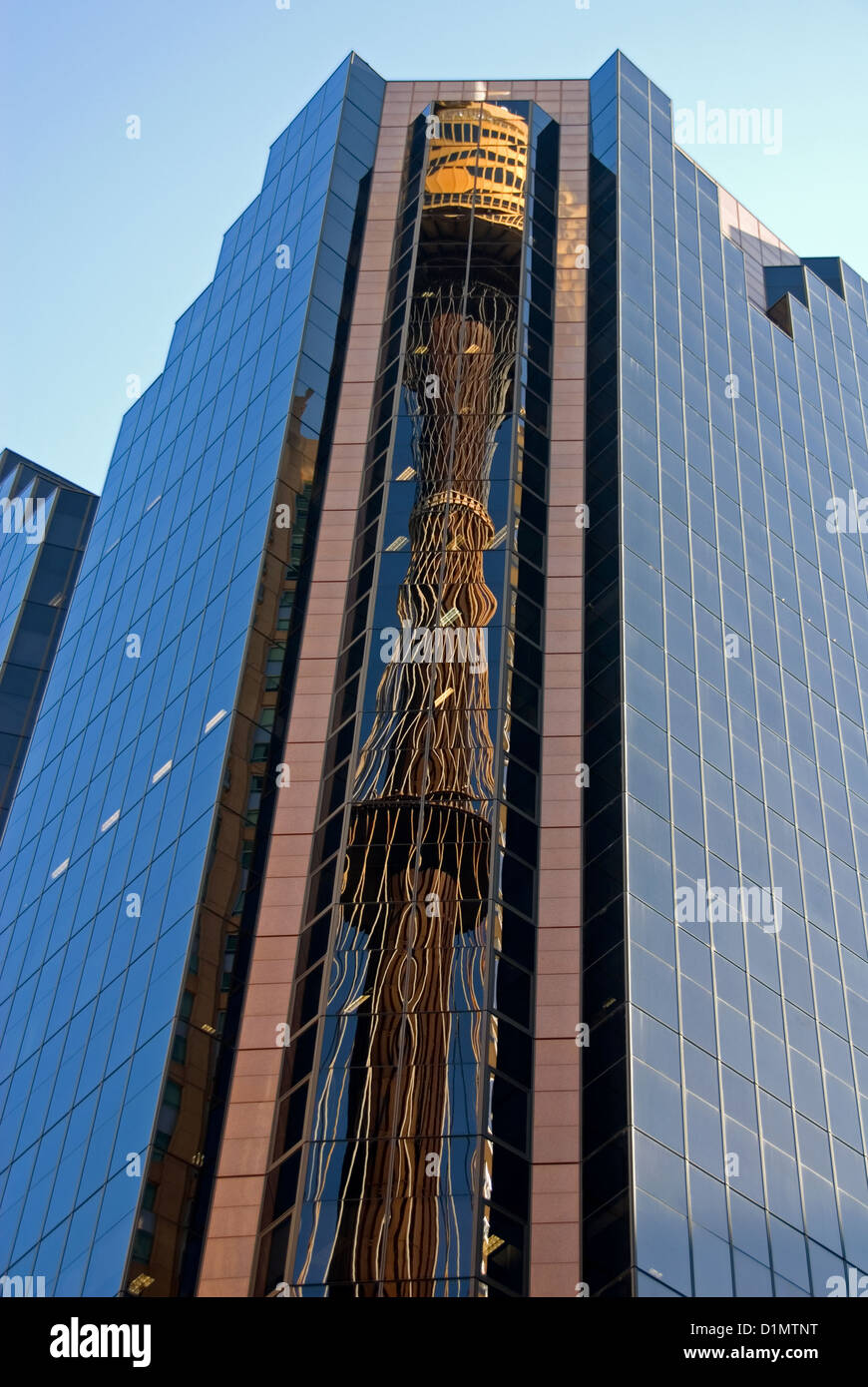 The reflection of Sydney's Centrepoint Tower in the glass facade of an ...