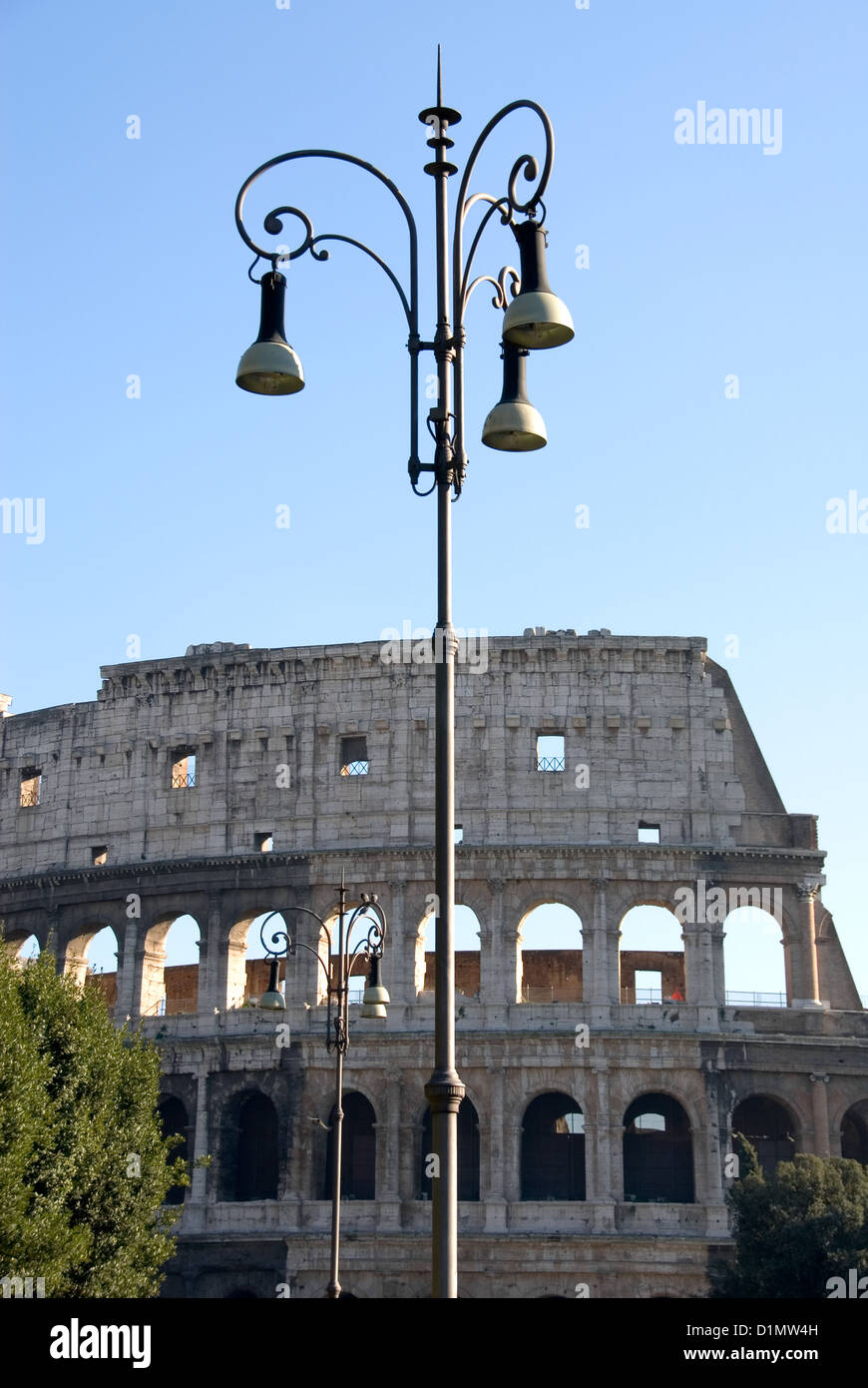 Street lights, with the famous Colosseum in the background, Rome, Italy ...