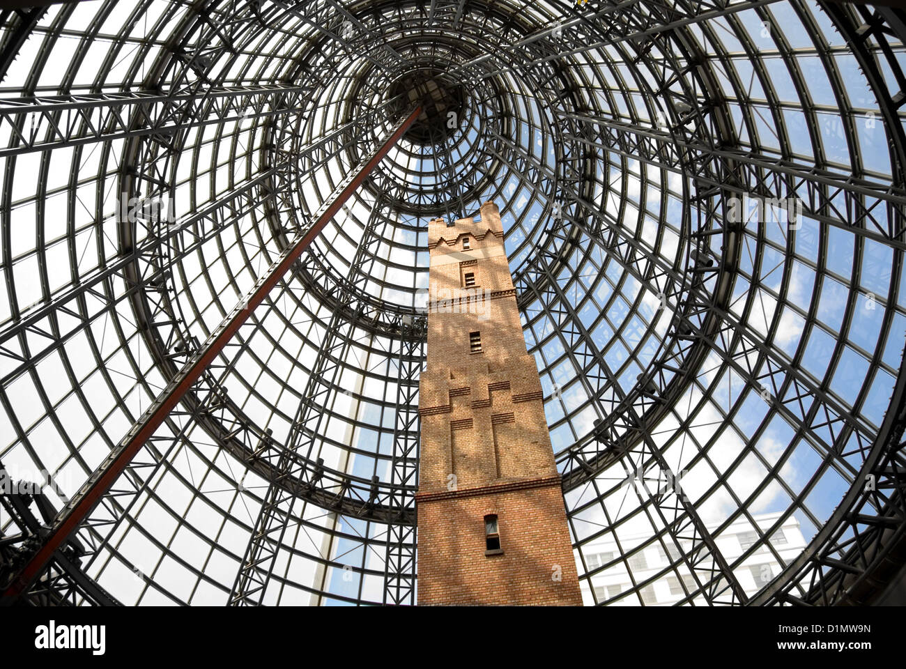 The high, steel-framed, conical-shaped, glass ceiling of a shopping ...