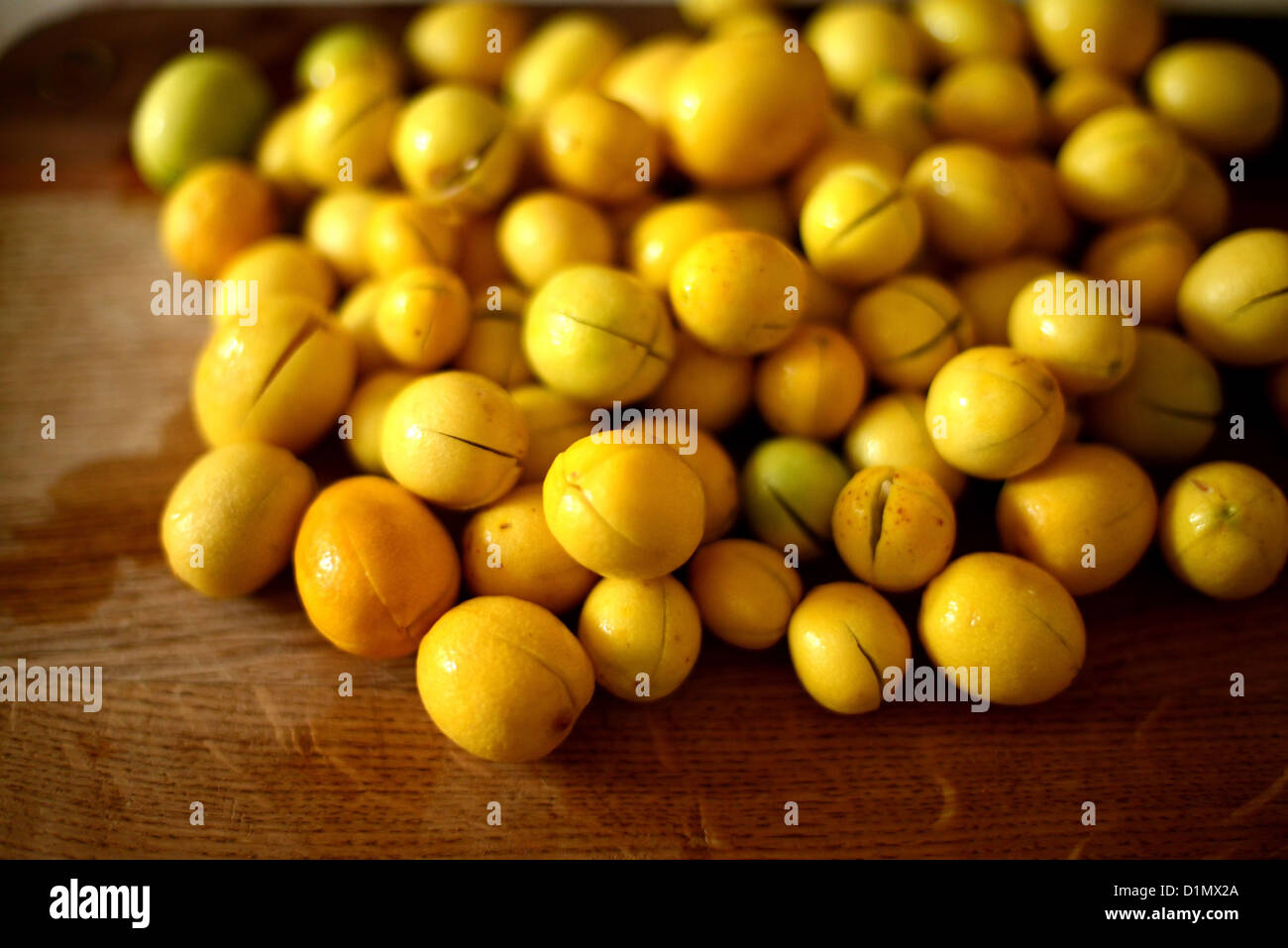 Home made olive curing. Cut olives are placed in a jar with brine Stock ...