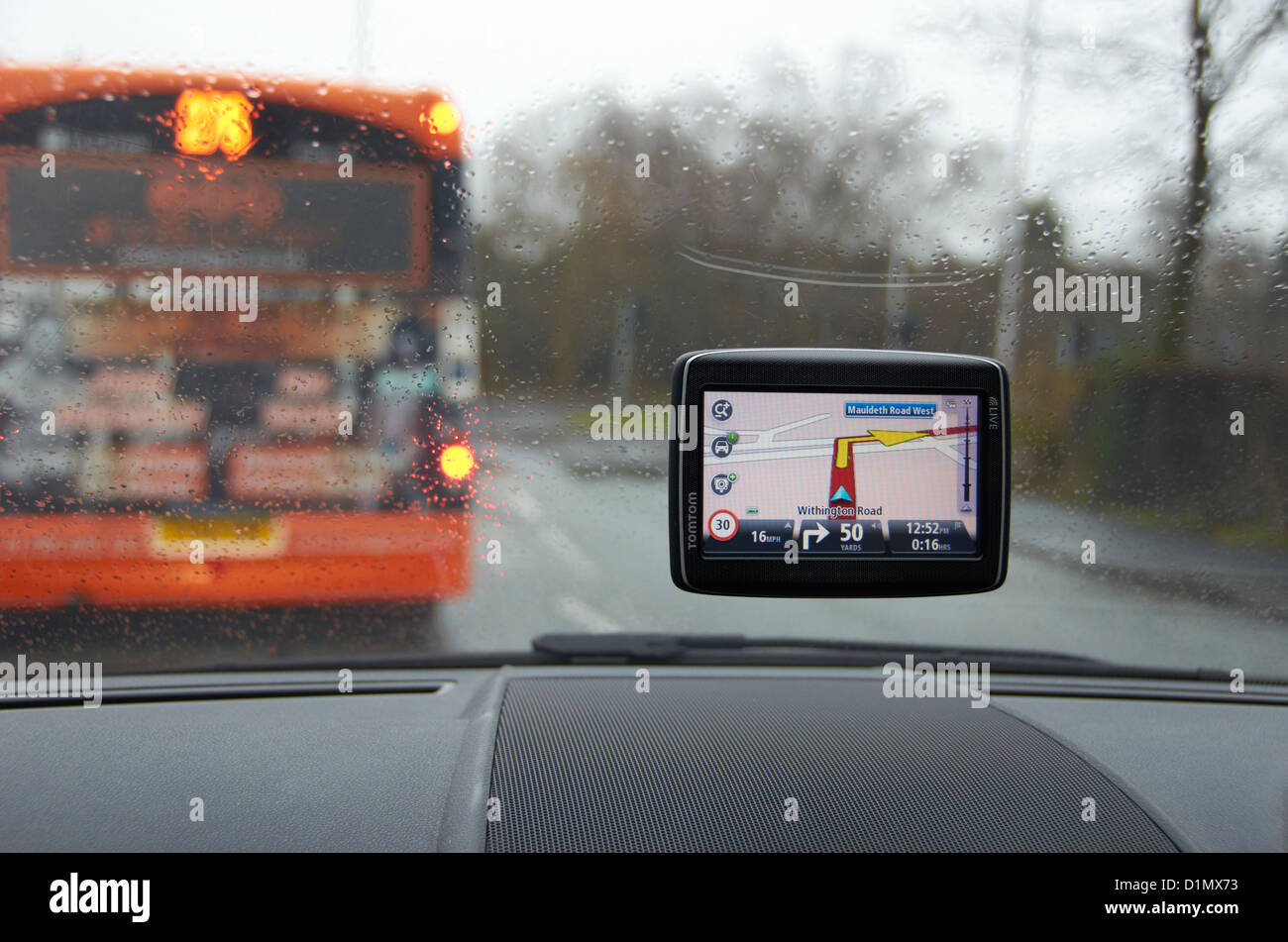Sat Nav on the screen of a vehicle (turning behind a bus) in Greater ...