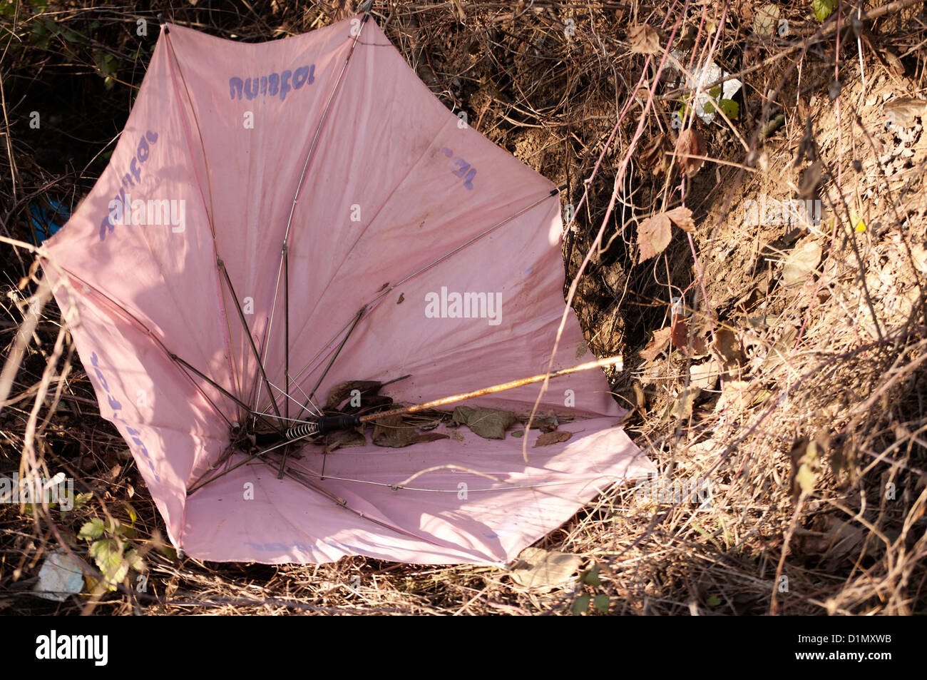 Broken umbrella on ground hi-res stock photography and images - Alamy