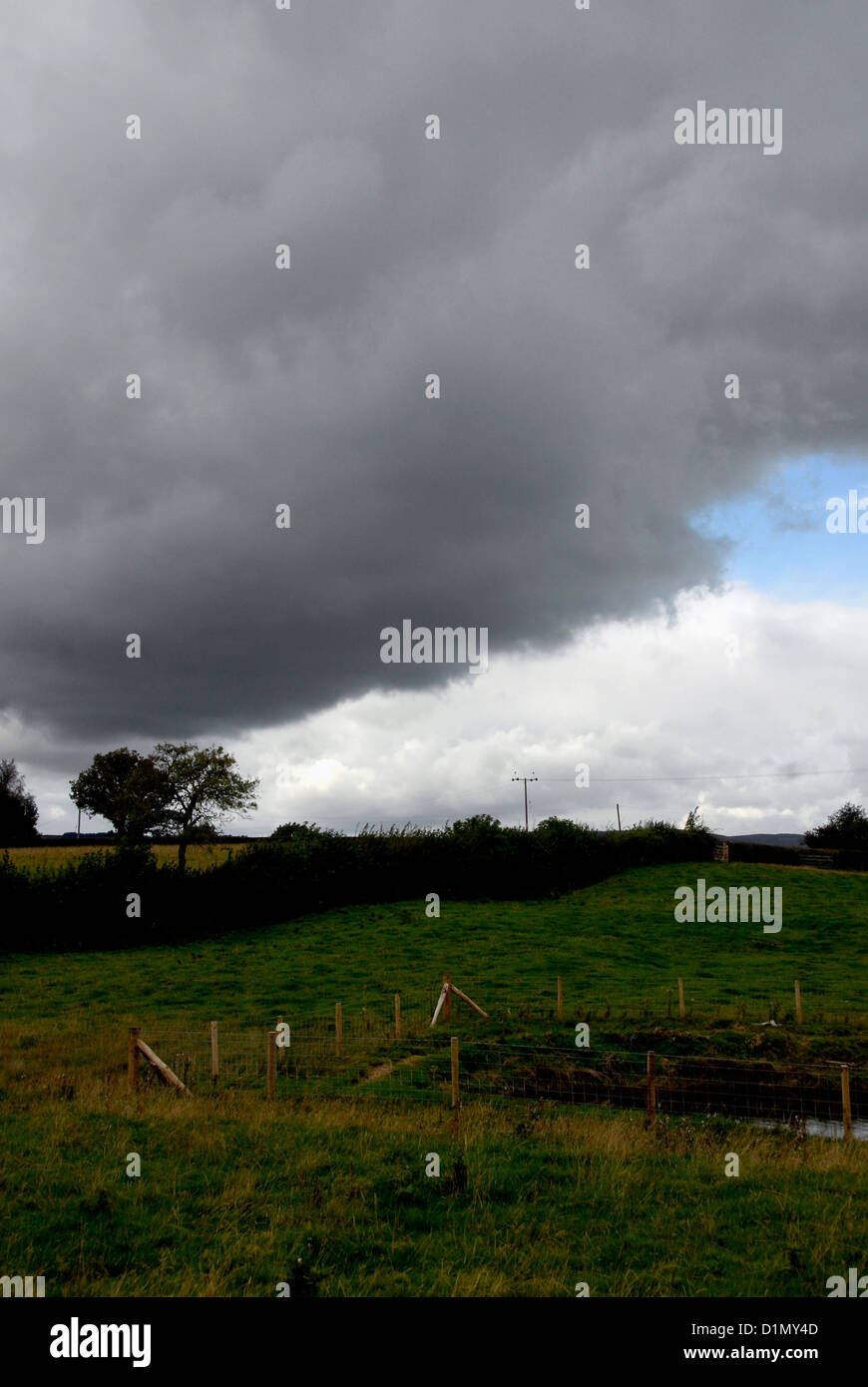 Rain clouds from a low weather front on countryside on Welsh-England ...