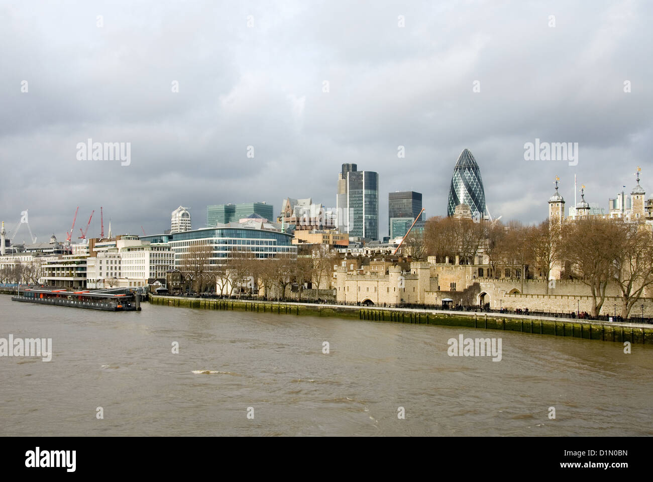 River thames with barge and city of london offices hi-res stock ...