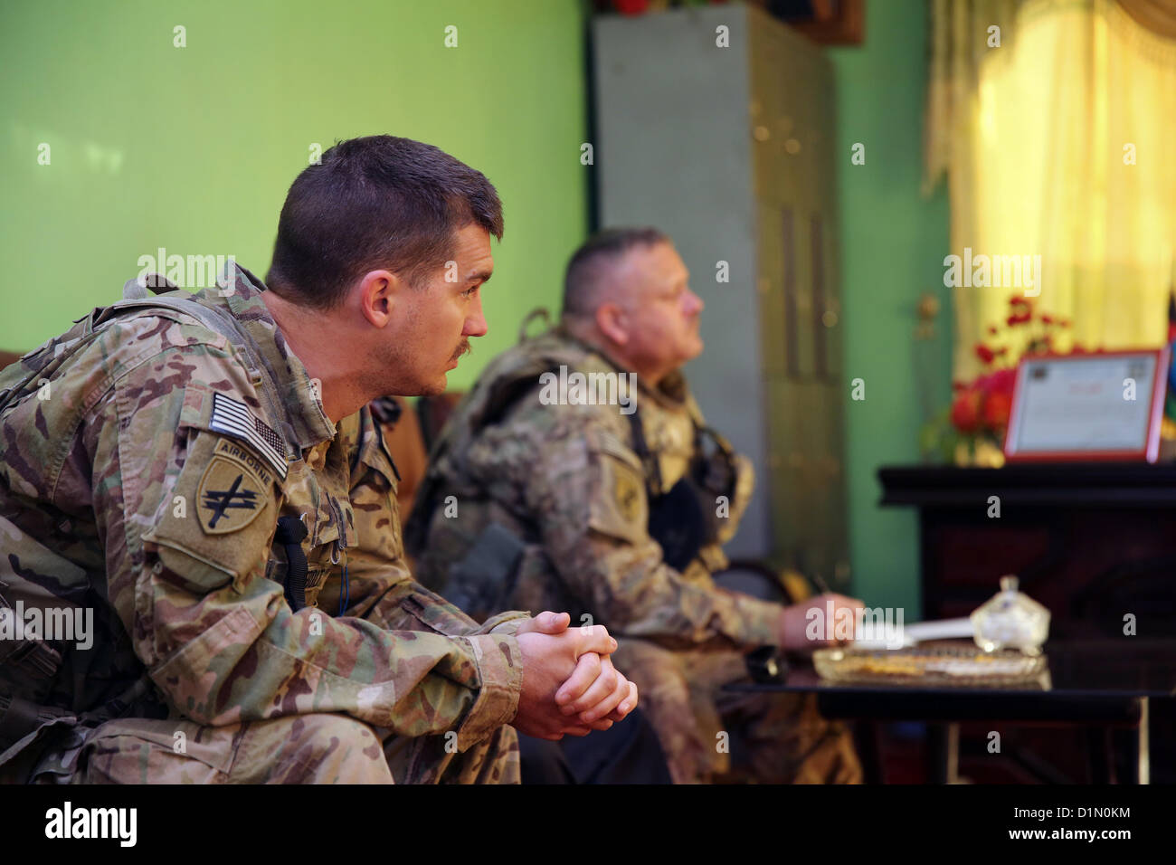 U.S. Army security team members attend a mission debrief following a ...