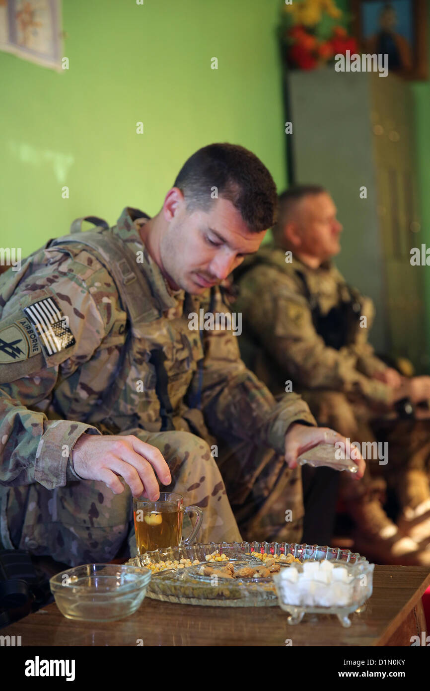 U.S. Army Spc. attends a mission debrief after a key leader engagement ...