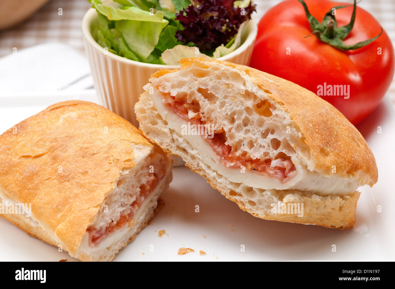 Italian ciabatta panini sandwich with parma ham and tomato Stock Photo ...