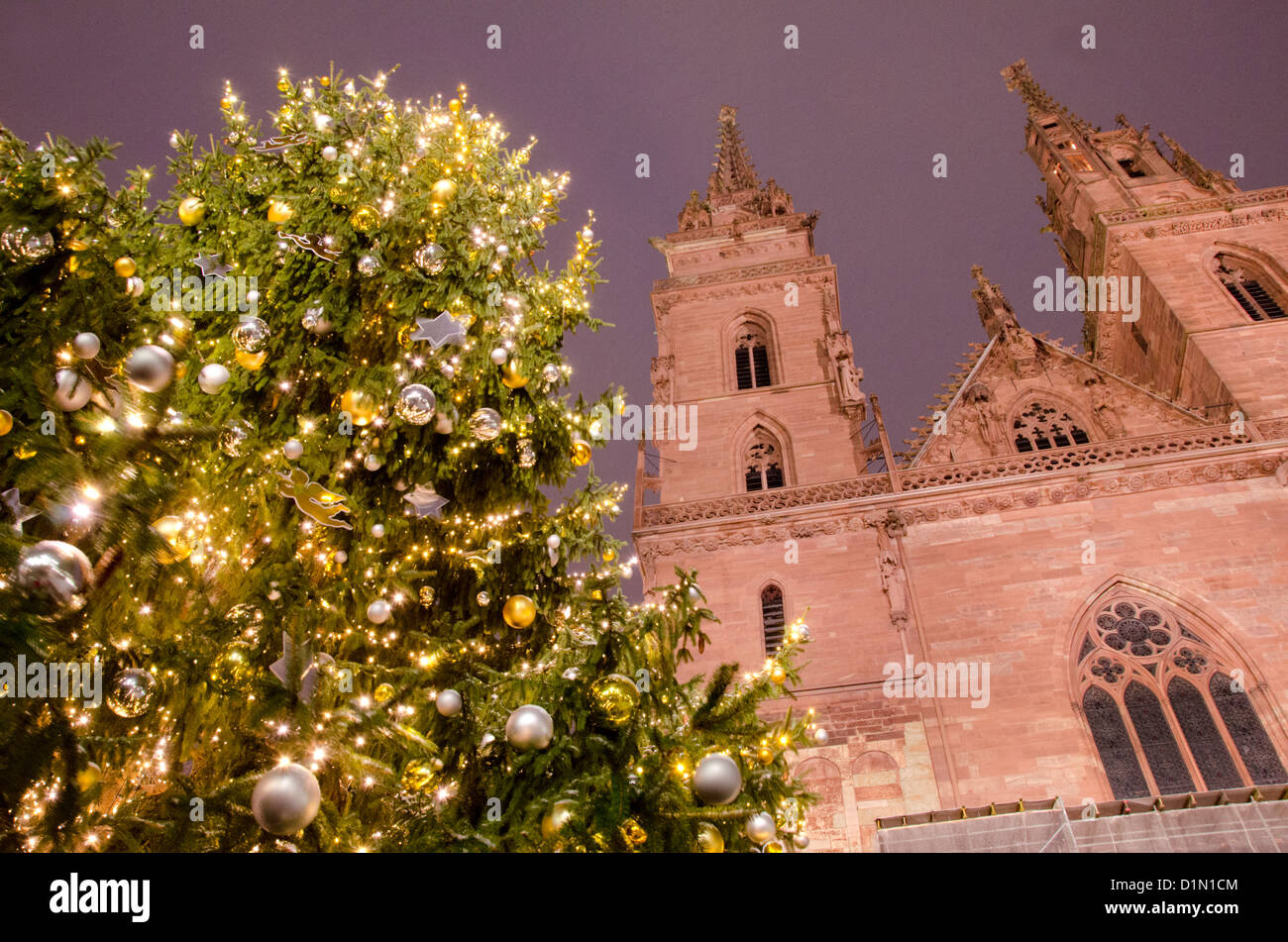 Switzerland, Basel. Historic church at Munsterplatz Winter Holiday ...