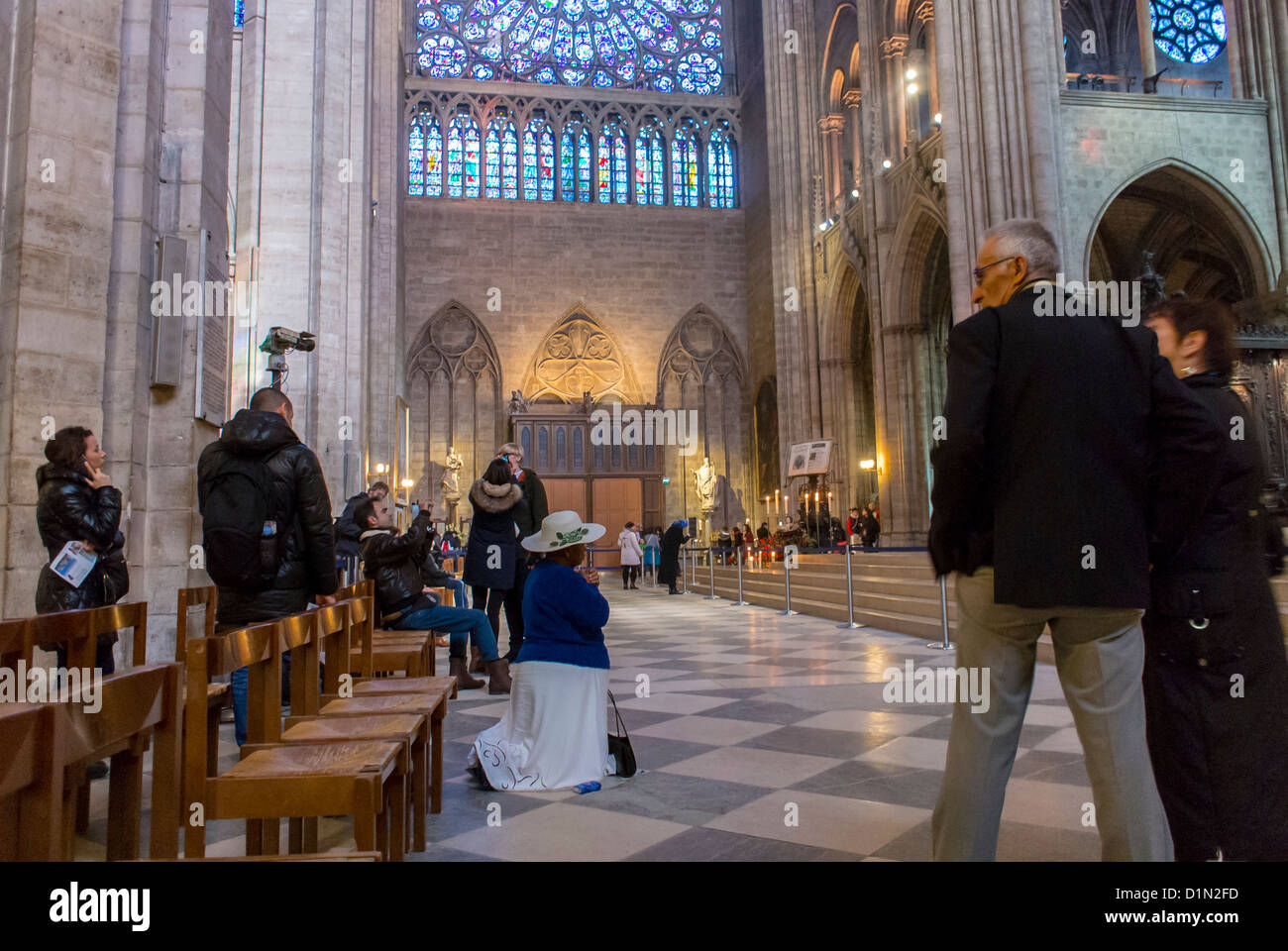 Paris, France, Woman praying, Crowd, at traditional catholic mass ...
