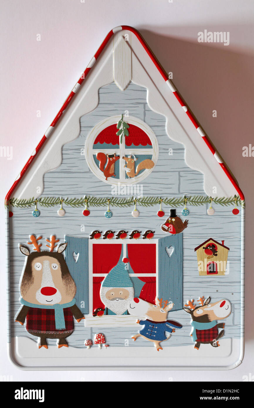 Decorative biscuit tin in shape of house isolated on white background ...