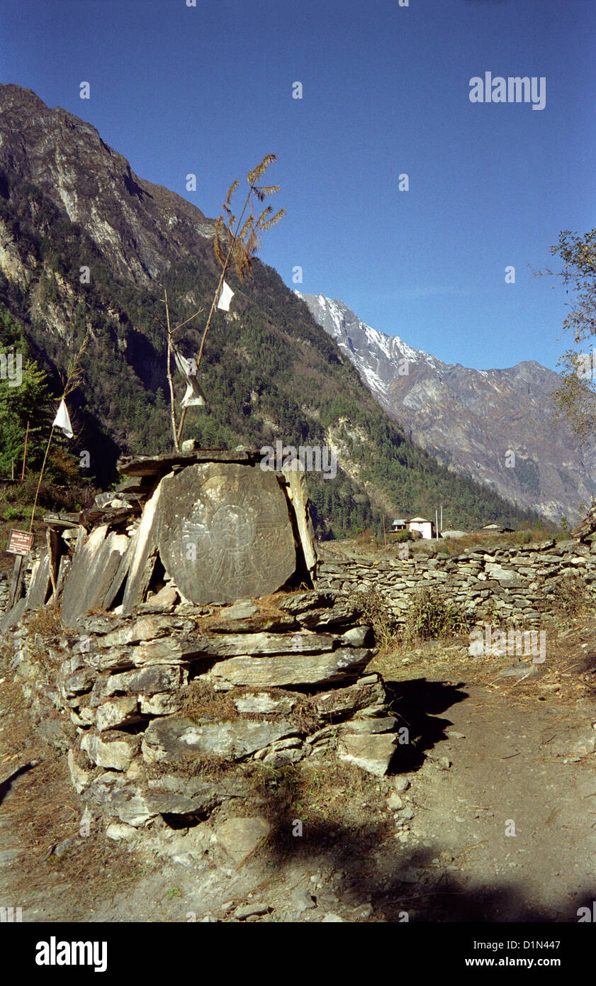 Prayers engraved incised carved on Mani stones at side of Annapurna ...