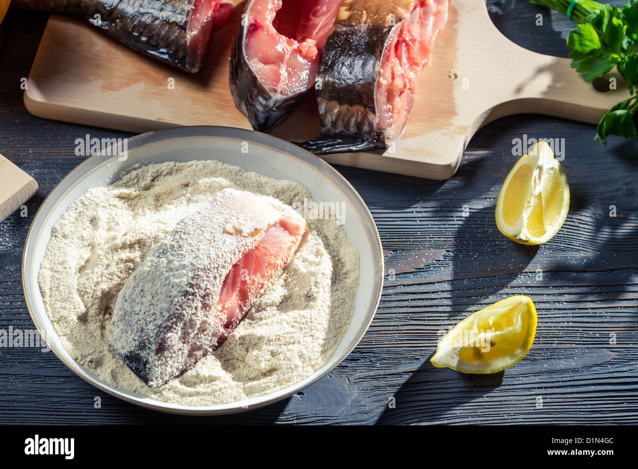 Fresh fish prepared in the traditional way in the flour Stock Photo - Alamy