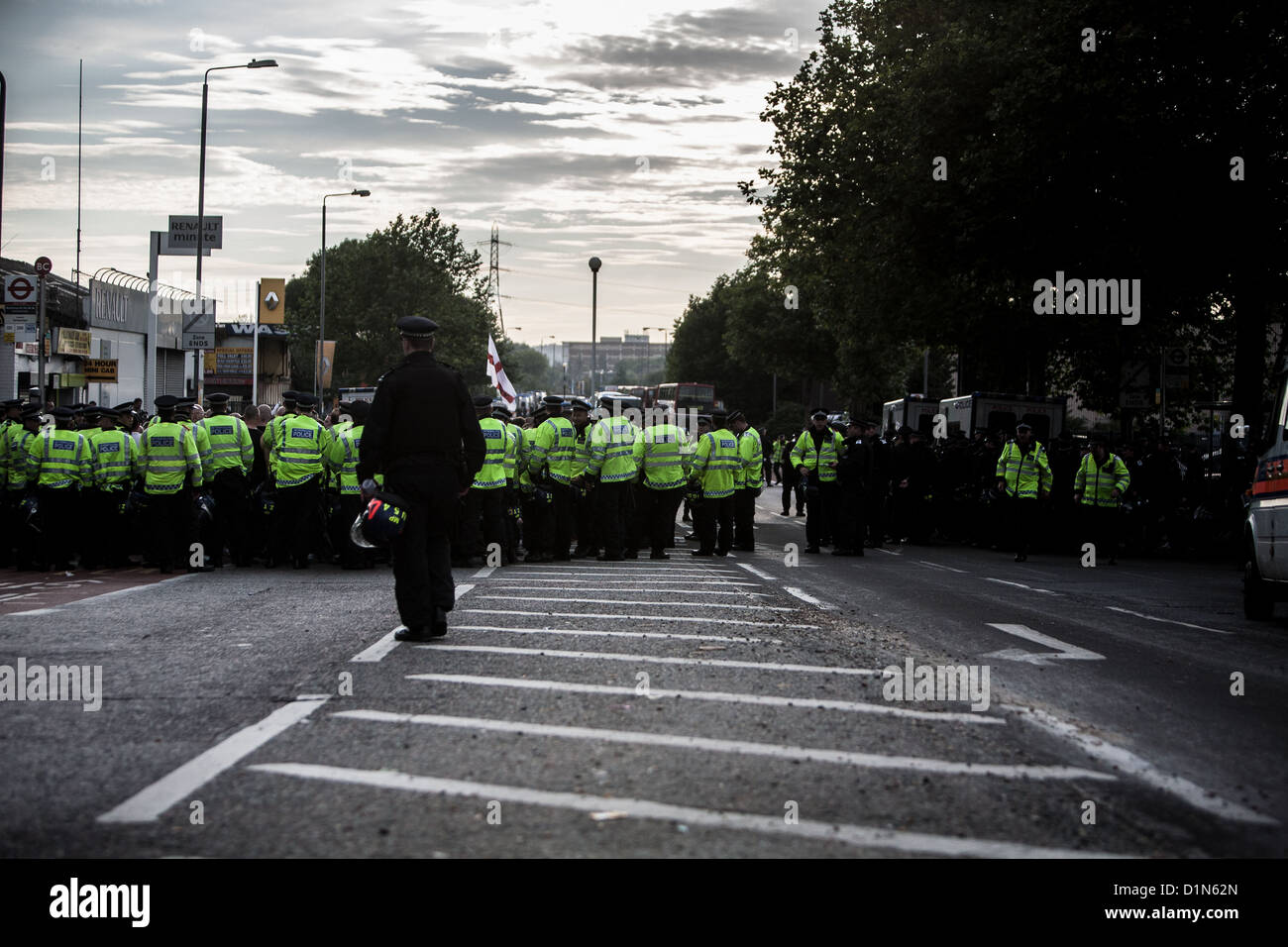 Lines of riot police under a darkening sky at dusk Stock Photo - Alamy