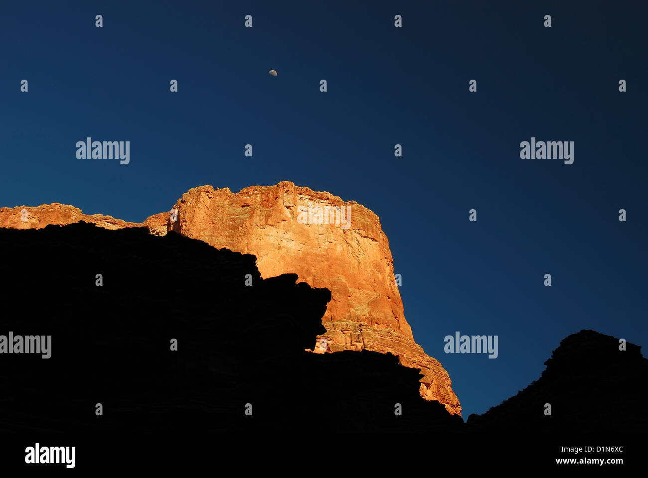 Moon and cliff lit by late afternoon light in the Grand Canyon, Arizona ...