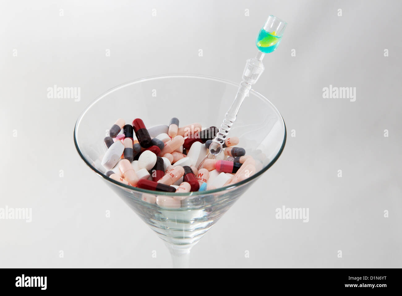 Prescription pills, tablets, capsules and martini glass. White ...