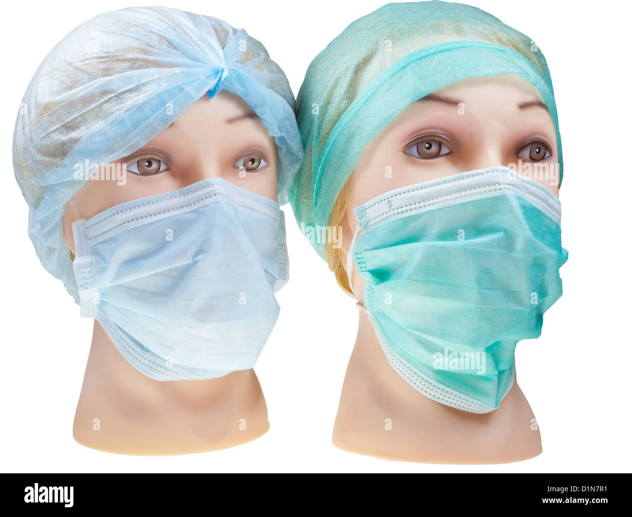 two women's dummy doctor heads wearing textile surgical cap and medical ...
