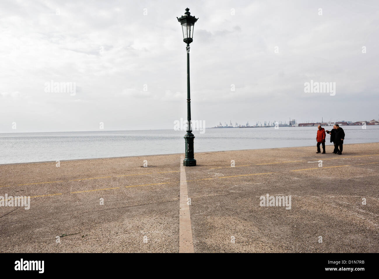 People stroll in the seafront of the northern Greece city of ...