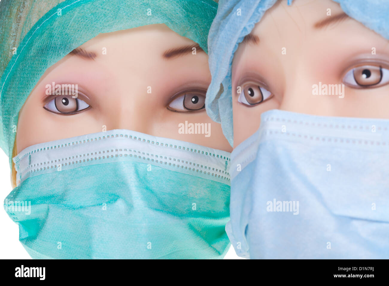 two female dummy doctor heads wearing textile surgical cap and medical ...