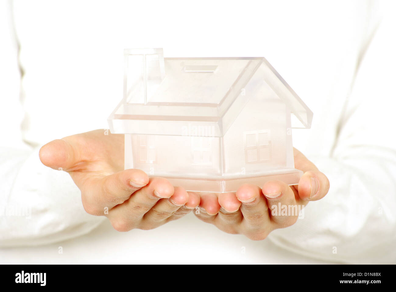 The house in human hands on white Stock Photo - Alamy