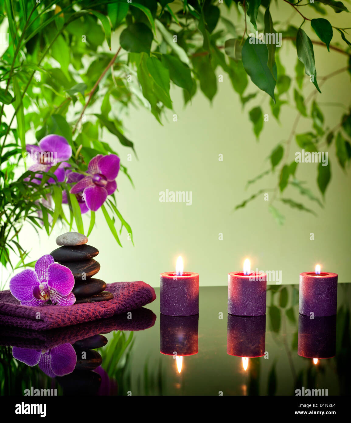 Spa still life with zen stones aromatic candles and orchid Stock Photo ...