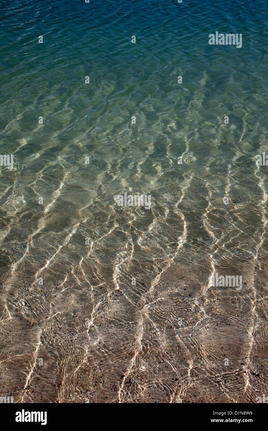 A background of sun and shadows on sandy ocean floor Stock Photo - Alamy