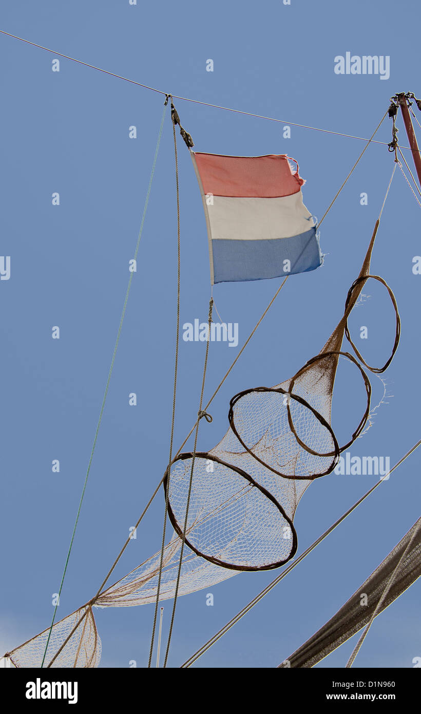 fishing net and the dutch red blue white flag Stock Photo - Alamy