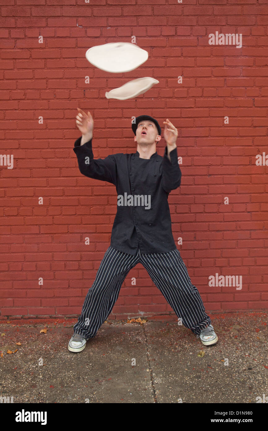 chef throwing pizza dough Stock Photo - Alamy